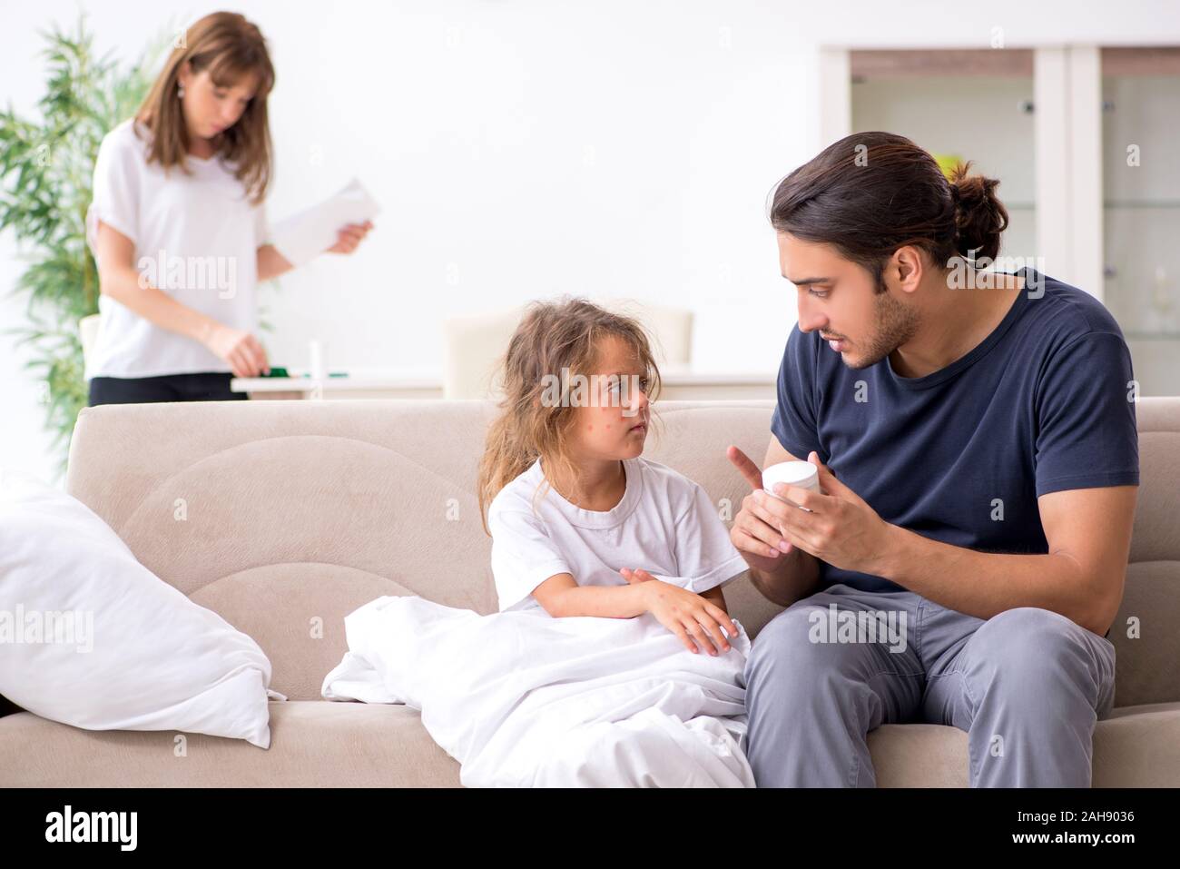 The father taking care of his ill daughter Stock Photo - Alamy