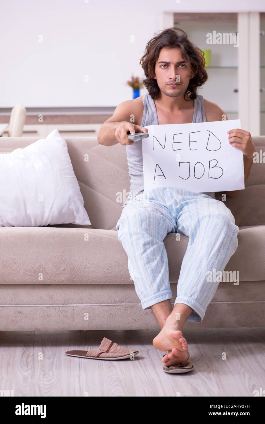 Unemployed man watching tv hi-res stock photography and images - Alamy