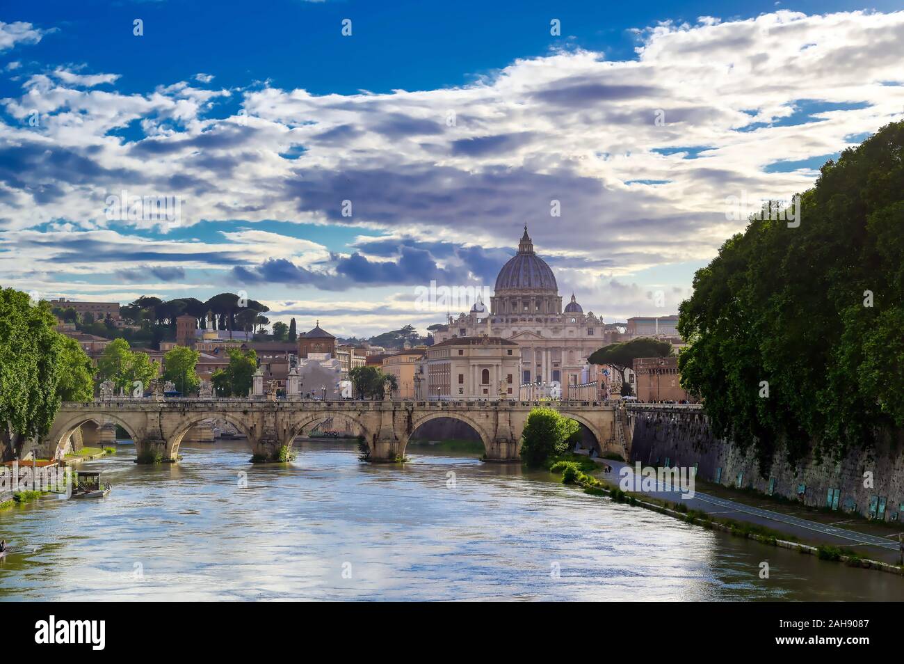A view along the Tiber River towards St. Peter's Basilica in Rome ...