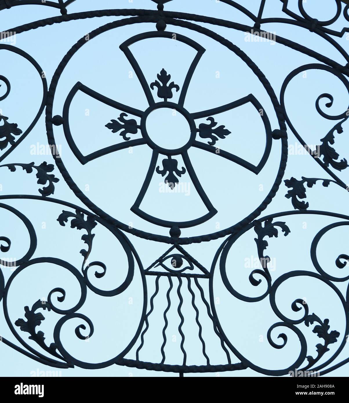 Metal forged cross with an all-seeing eye - a symbol of masons Stock ...