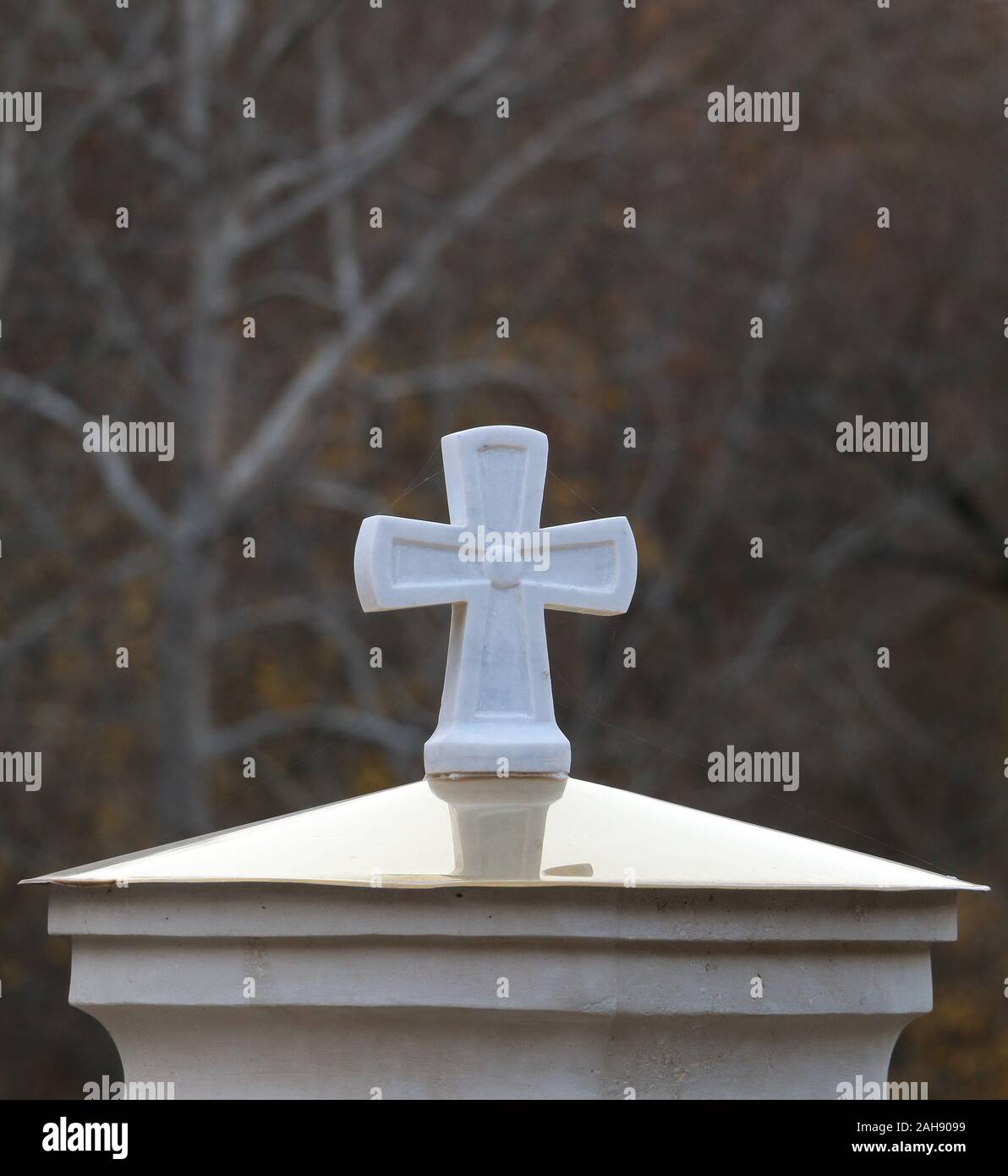 marble cross on a column Stock Photo - Alamy