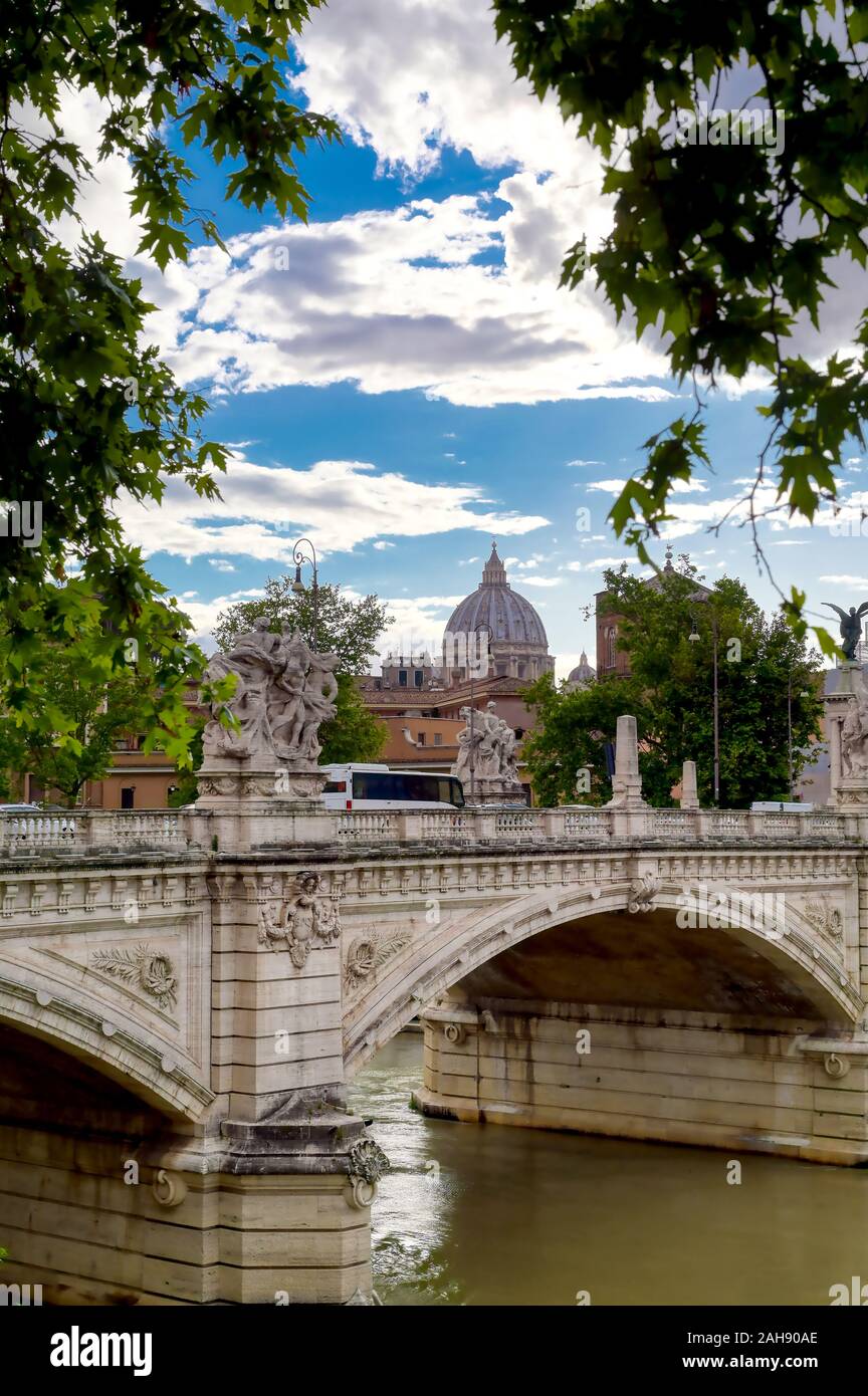 A view along the Tiber River towards St. Peter's Basilica in Rome ...