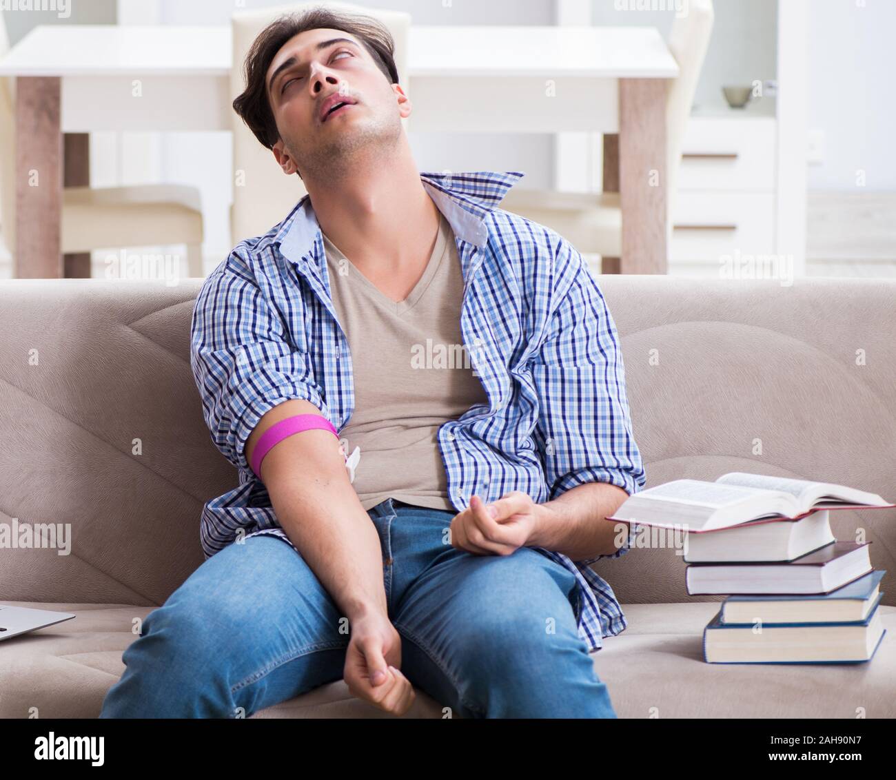 Young student suffeting from drug addiction Stock Photo - Alamy
