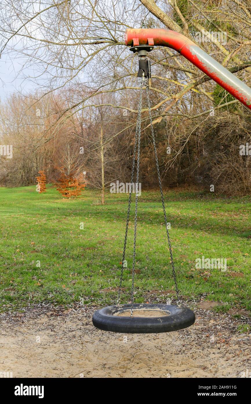 A swing for children with a hoop on a playground in a park Stock Photo ...