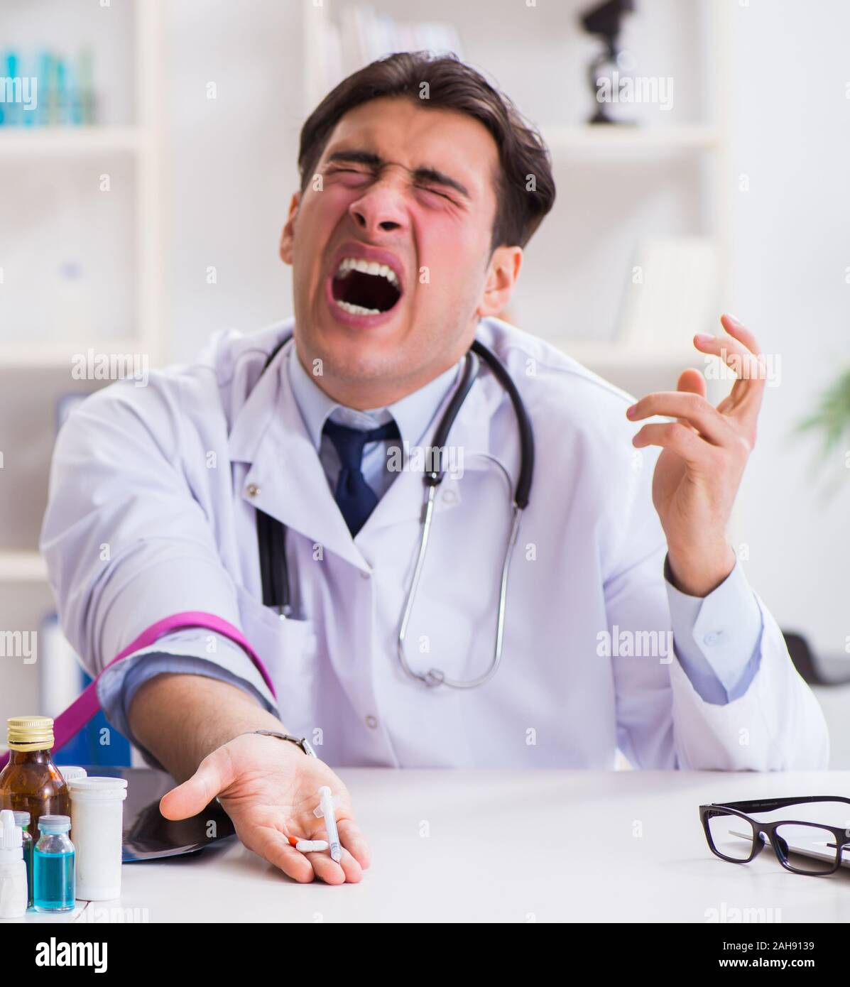Doctor drug addict in the hospital Stock Photo - Alamy
