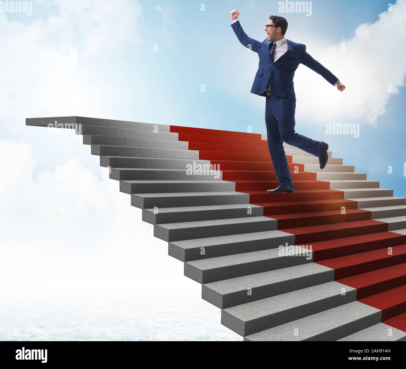 The young businessman climbing stairs and red carpet into sky Stock ...