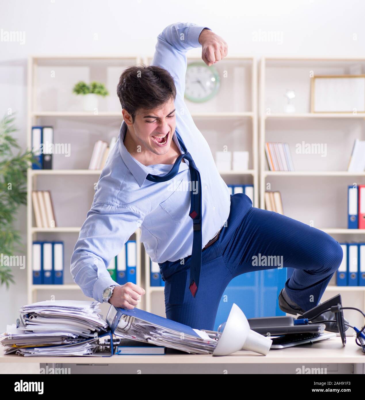 The angry businessman frustrated with too much work Stock Photo - Alamy