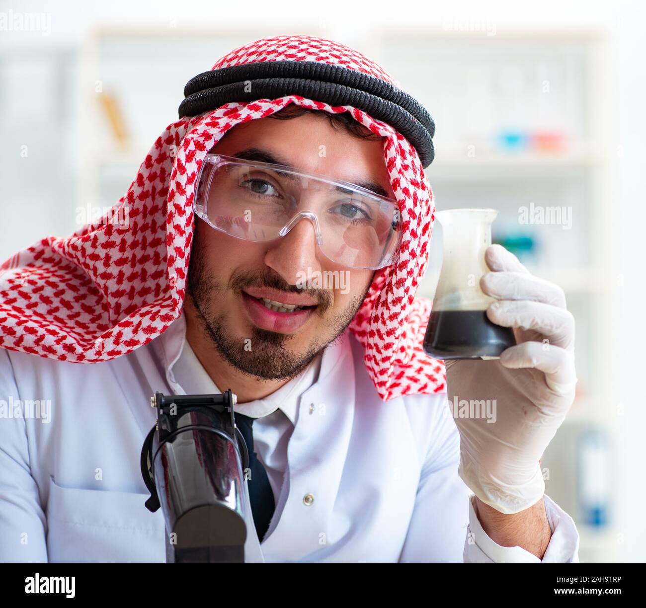 The arab chemist scientist testing quality of oil petrol Stock Photo ...