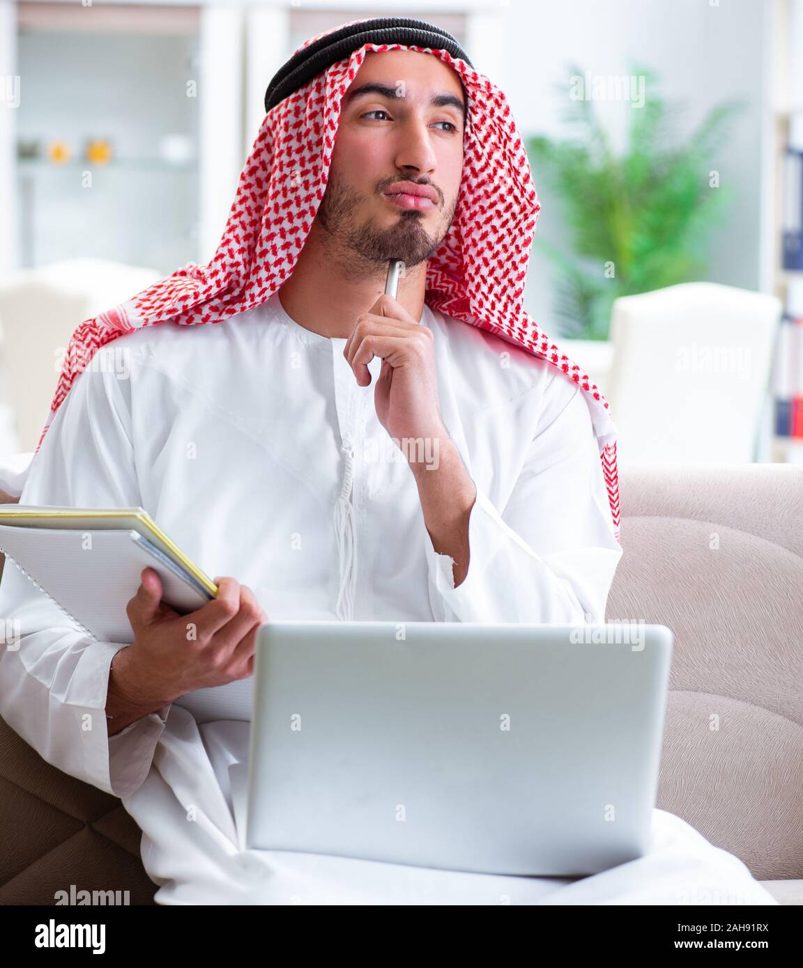 The arab man working at home on his work Stock Photo - Alamy