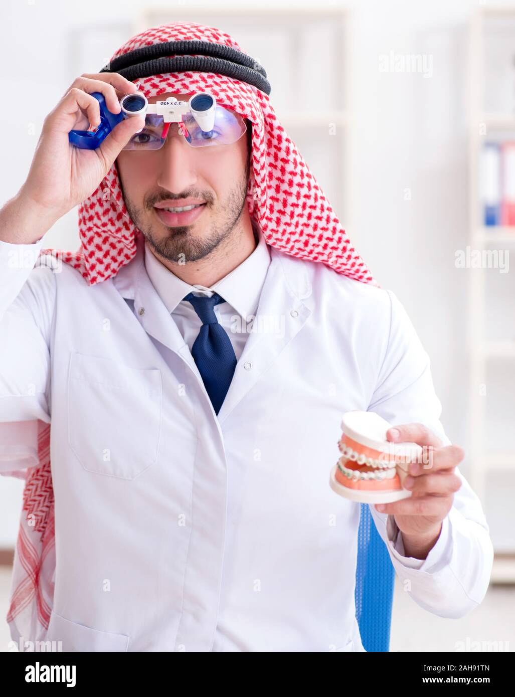 The arab dentist working on new teeth implant Stock Photo - Alamy