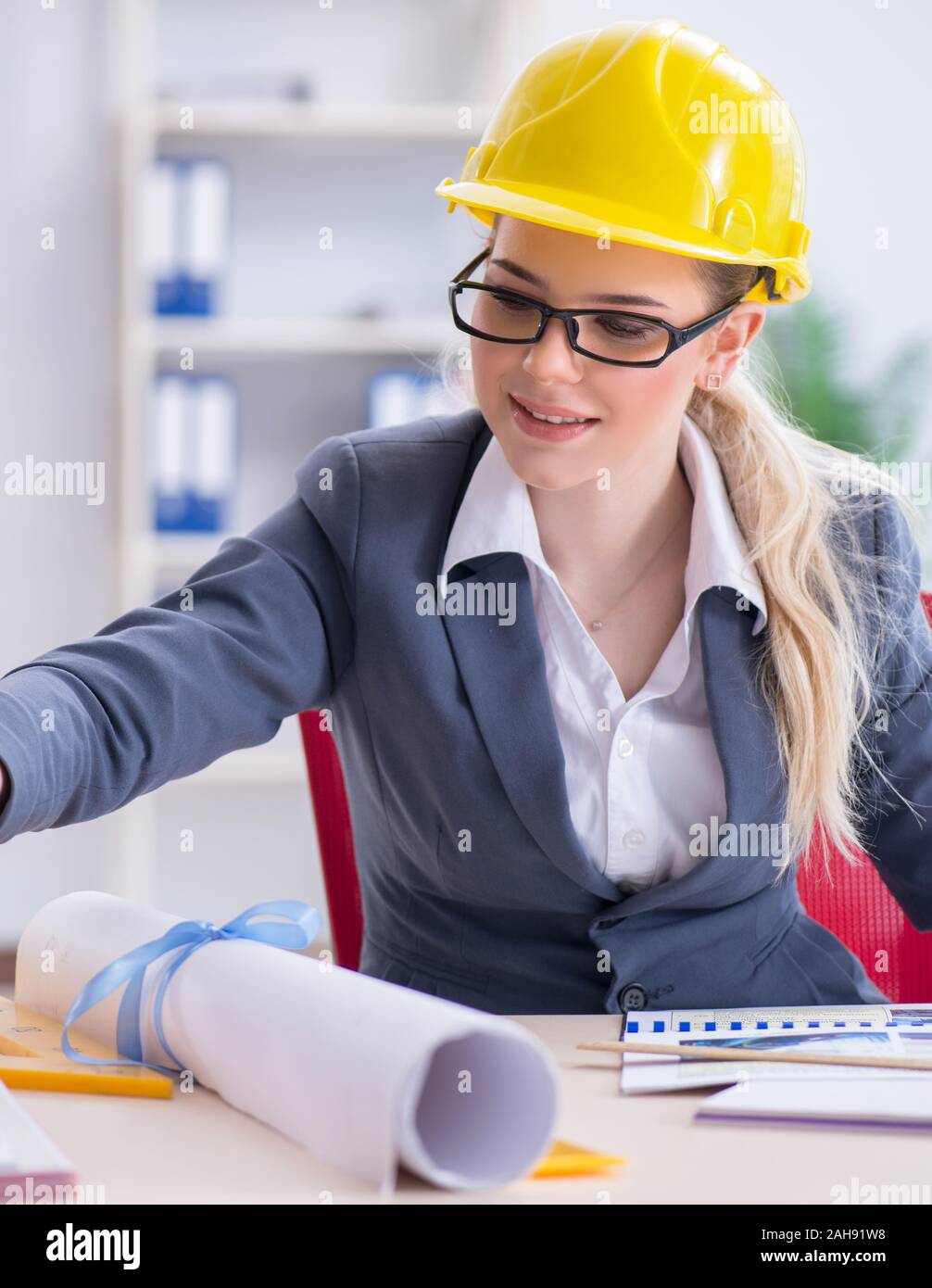 The woman architect working on the project Stock Photo - Alamy