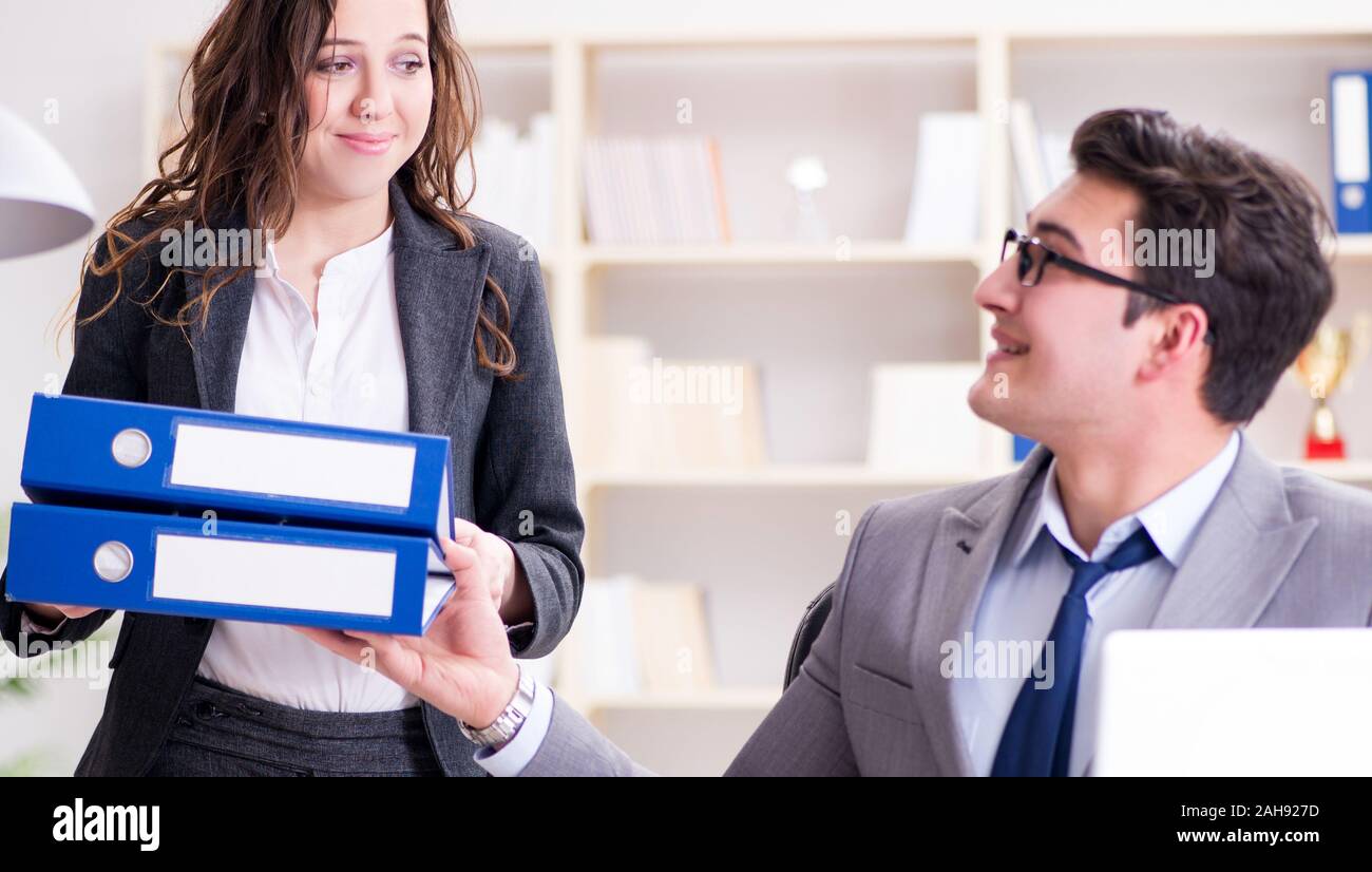 The businessman asking for paperwork from his assistant secretary Stock ...