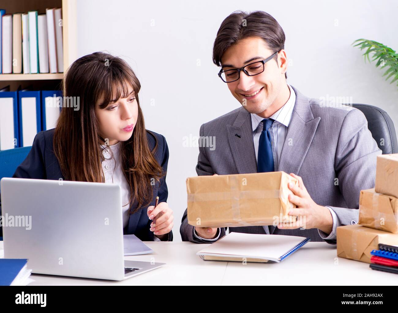 The business people receiving new mail and parcels Stock Photo - Alamy