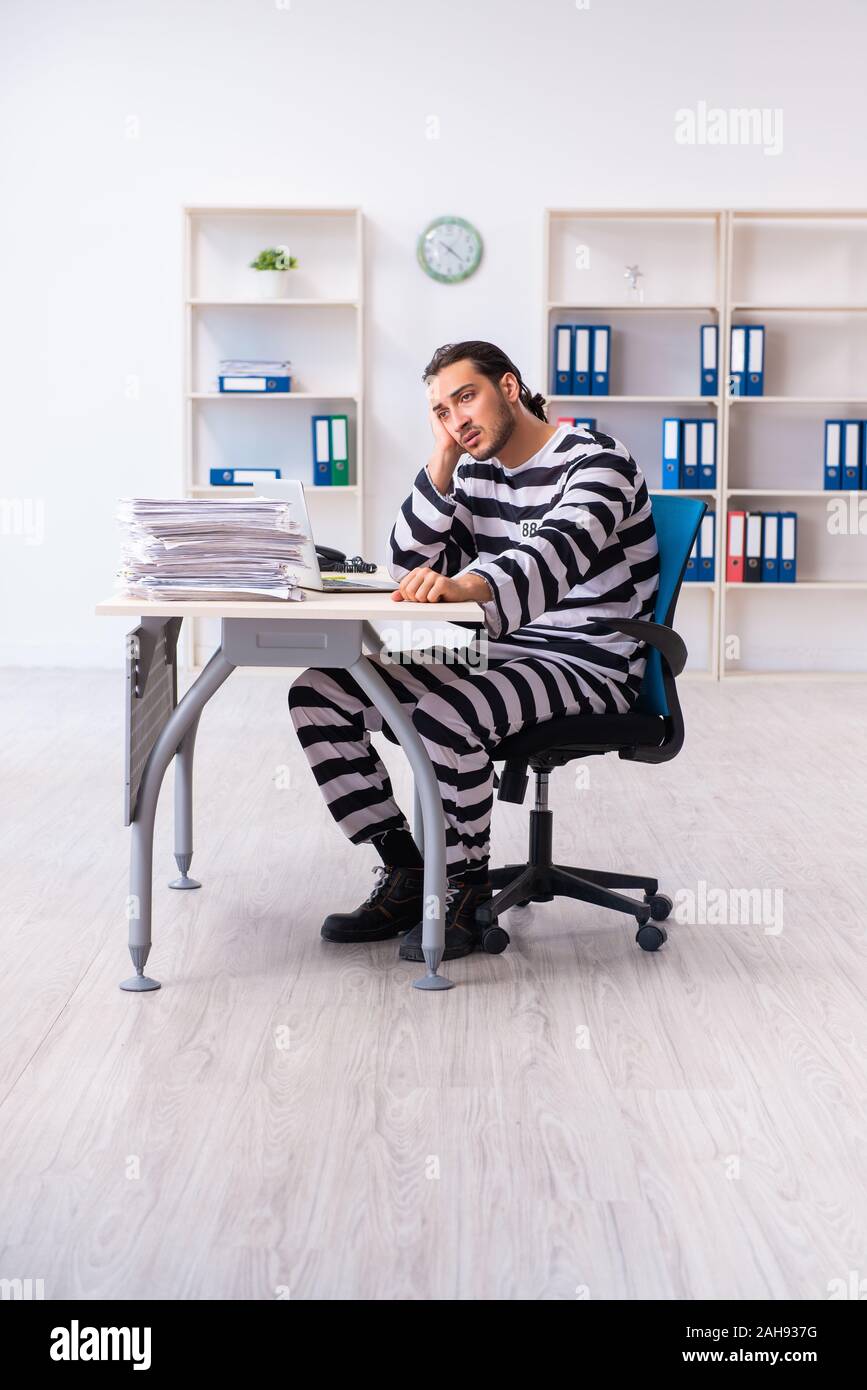 The young employee feeling like prisoner at work Stock Photo - Alamy