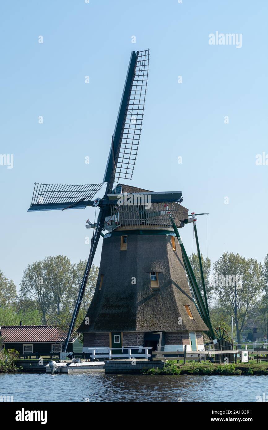 Waterways of North Holland and view on traditional Dutch wind mill ...
