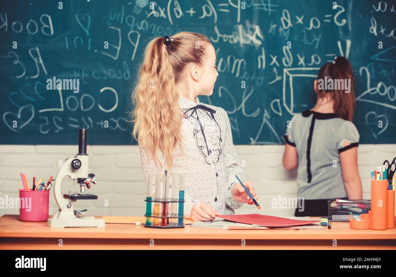 Little girls in lab. Microscope. Biology lesson. Back to school ...