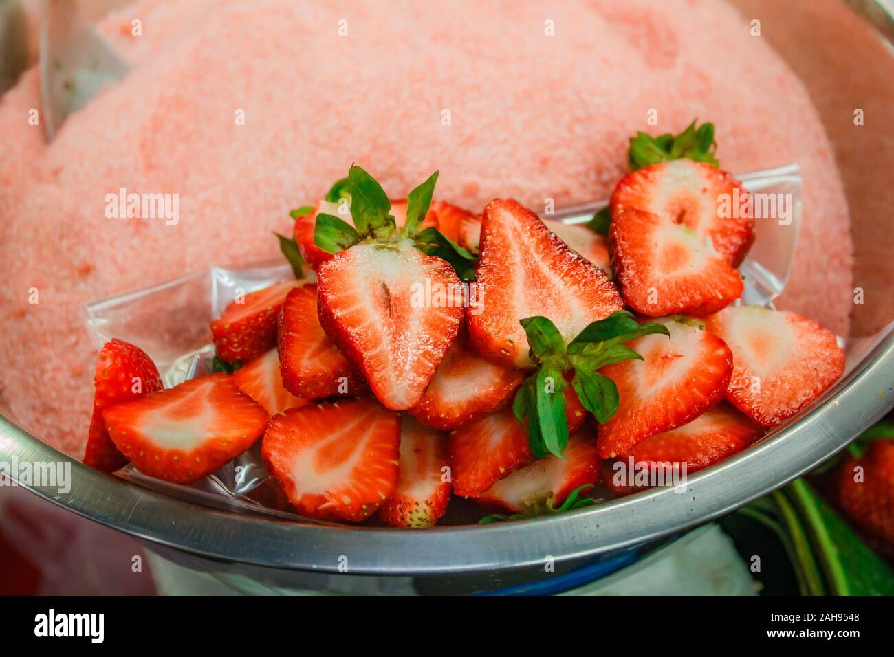 Strawberry in a bowl and sugar with chili at market Stock Photo - Alamy