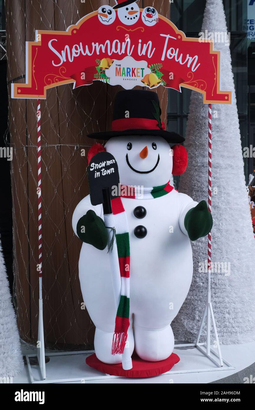 Snow man smiling standing to welcome customers Stock Photo - Alamy