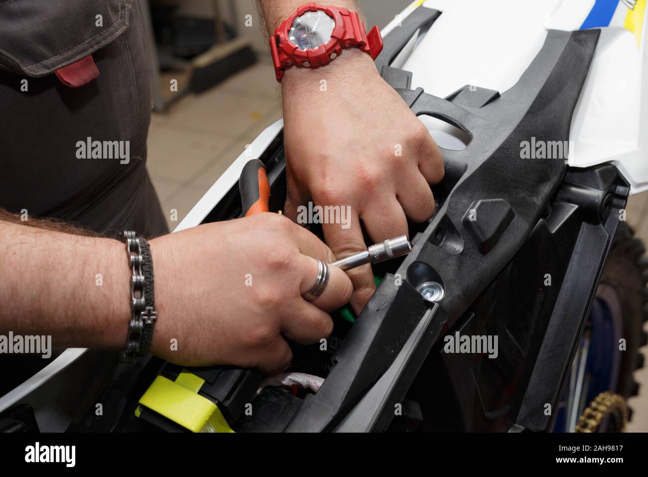 The wizard installs a new battery on the motorcycle after refueling and ...