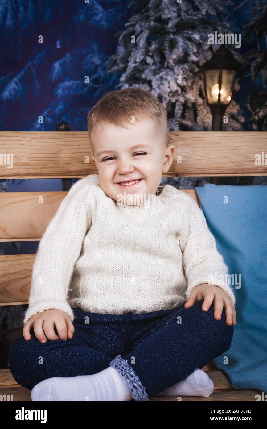 infant sitting on the bench Stock Photo - Alamy