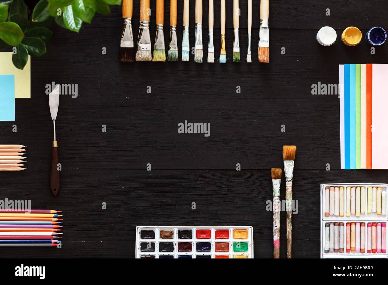 Creative art painting drawing supplies tools set on wooden desk top ...