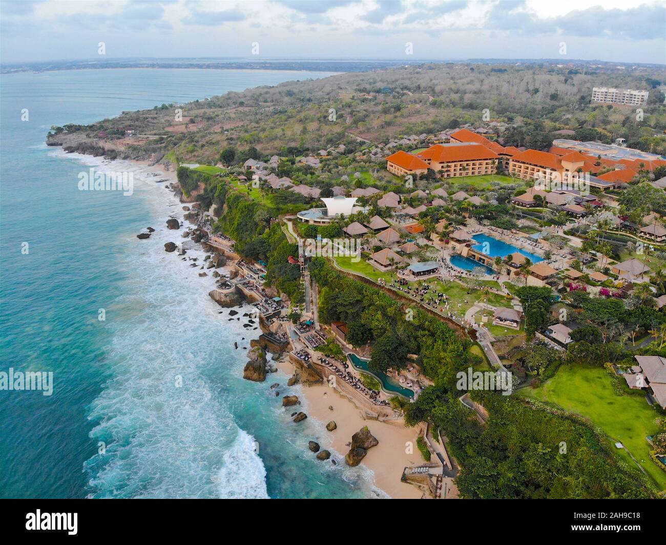 Aerial view of luxury hotel and private villa with swimming pool in the ...