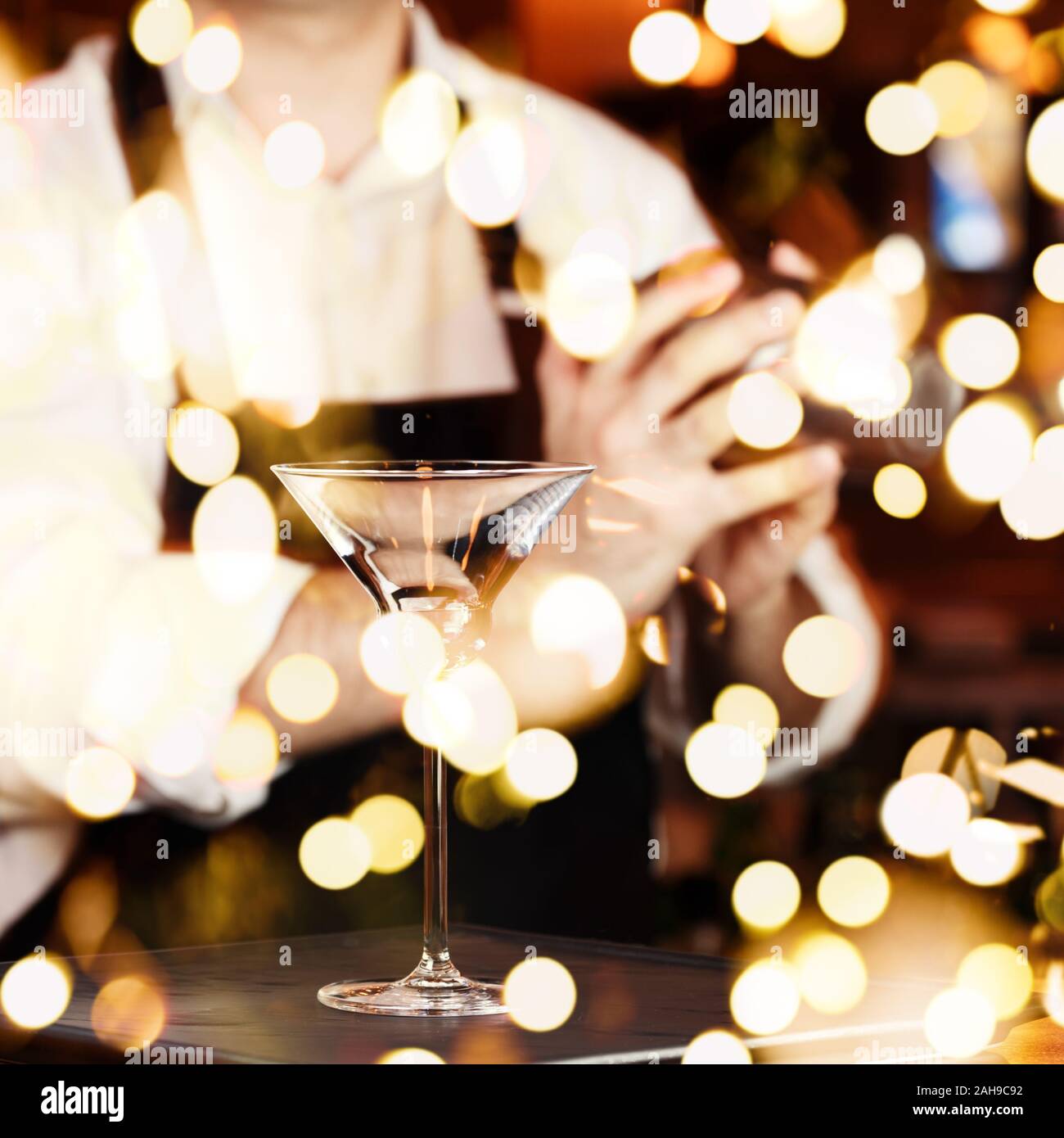 Barman in making cocktail at a nightclub. Nightlife concept. No face ...