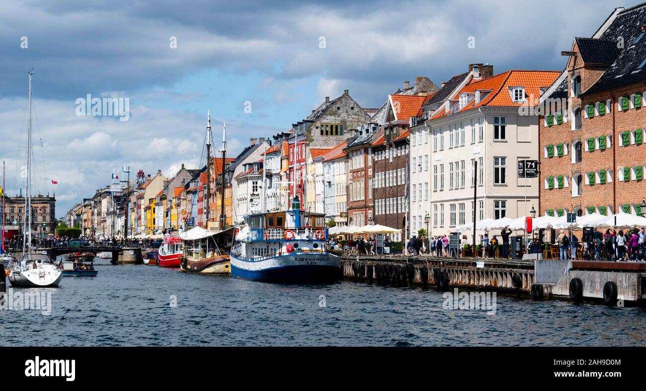 Coloured houses and sailing boats on Nyhavn canal, Copenhagen, Denmark ...