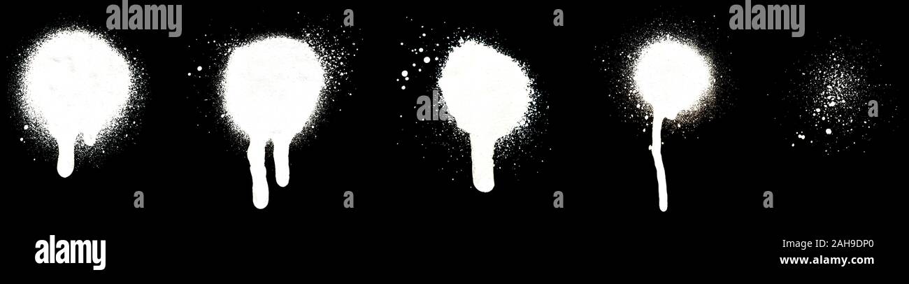 Close-up of several white spray paint spots, splashes and drips ...