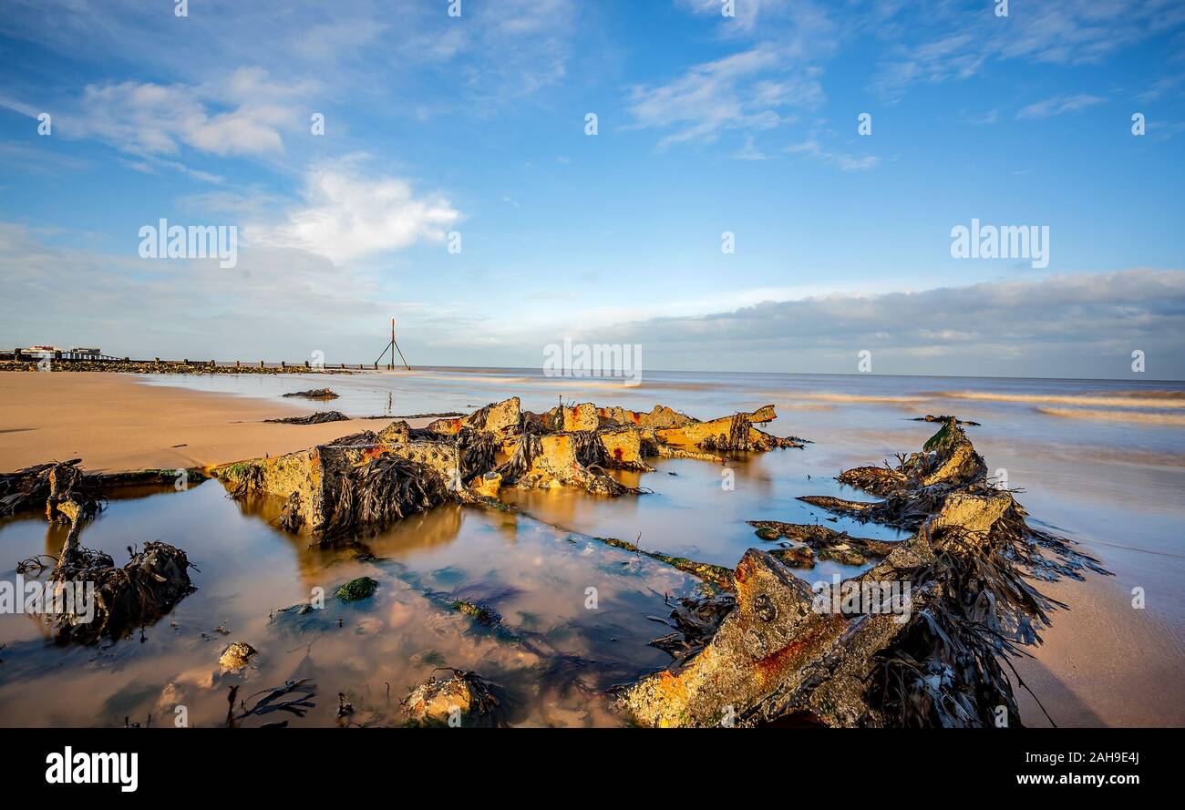 Long exposure photo of rock pool on a sandy beach Stock Photo - Alamy