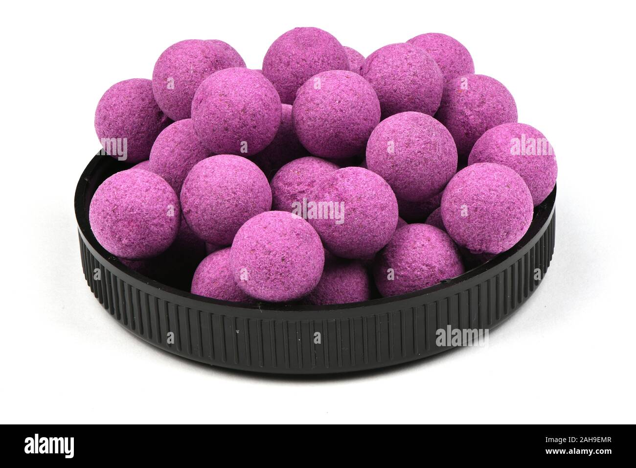 Bowl full of boilies, fishing baits for carp, isolated on white ...