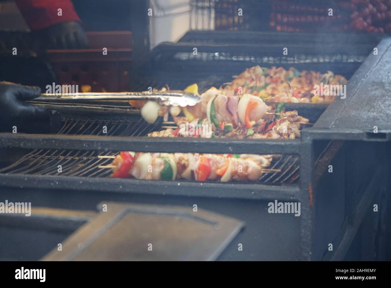 Barbecue with delicious grilled meat on grill on christmas market Stock ...