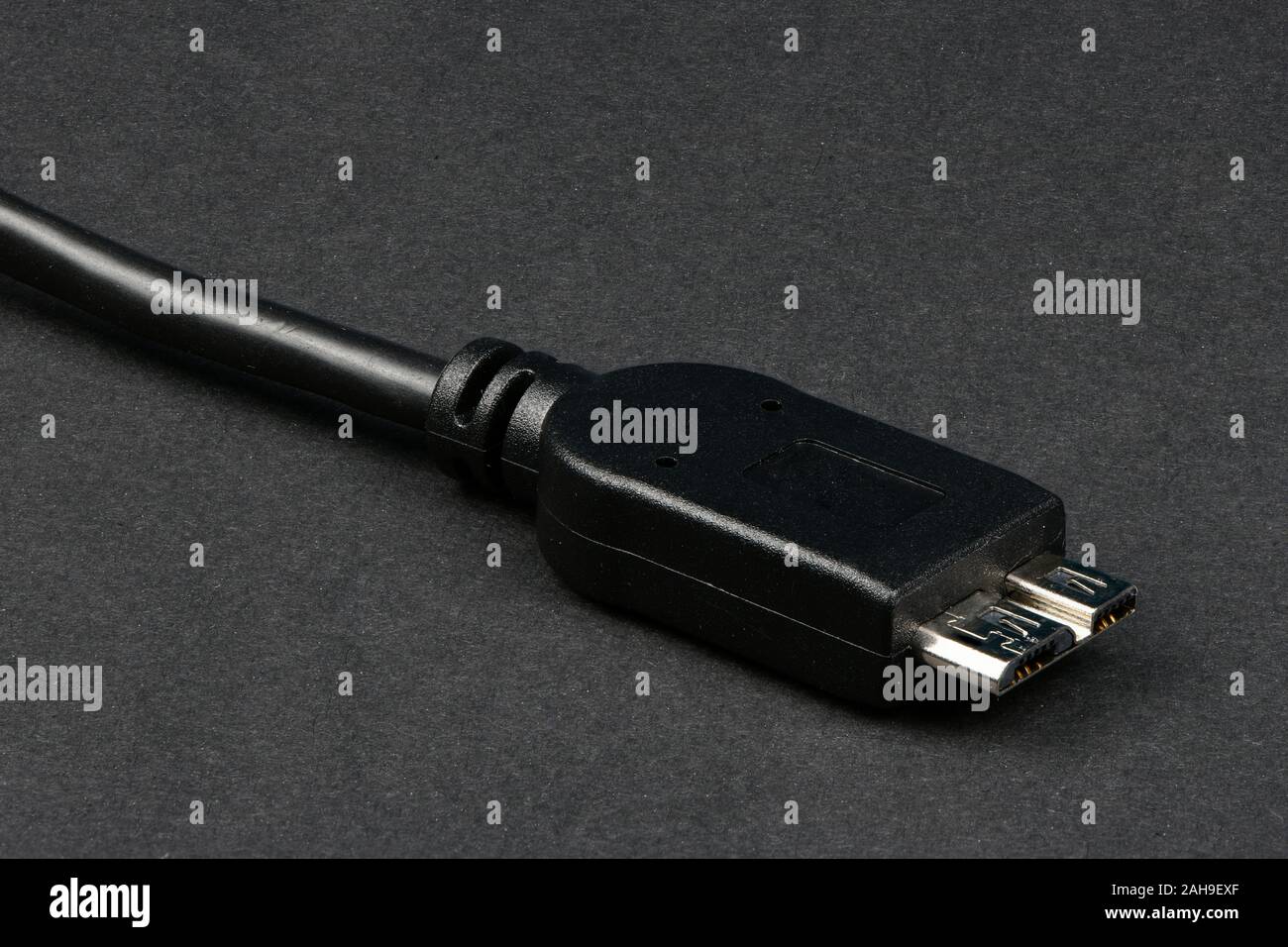 Closeup USB cable isolated on black. High resolution photo. Full depth ...