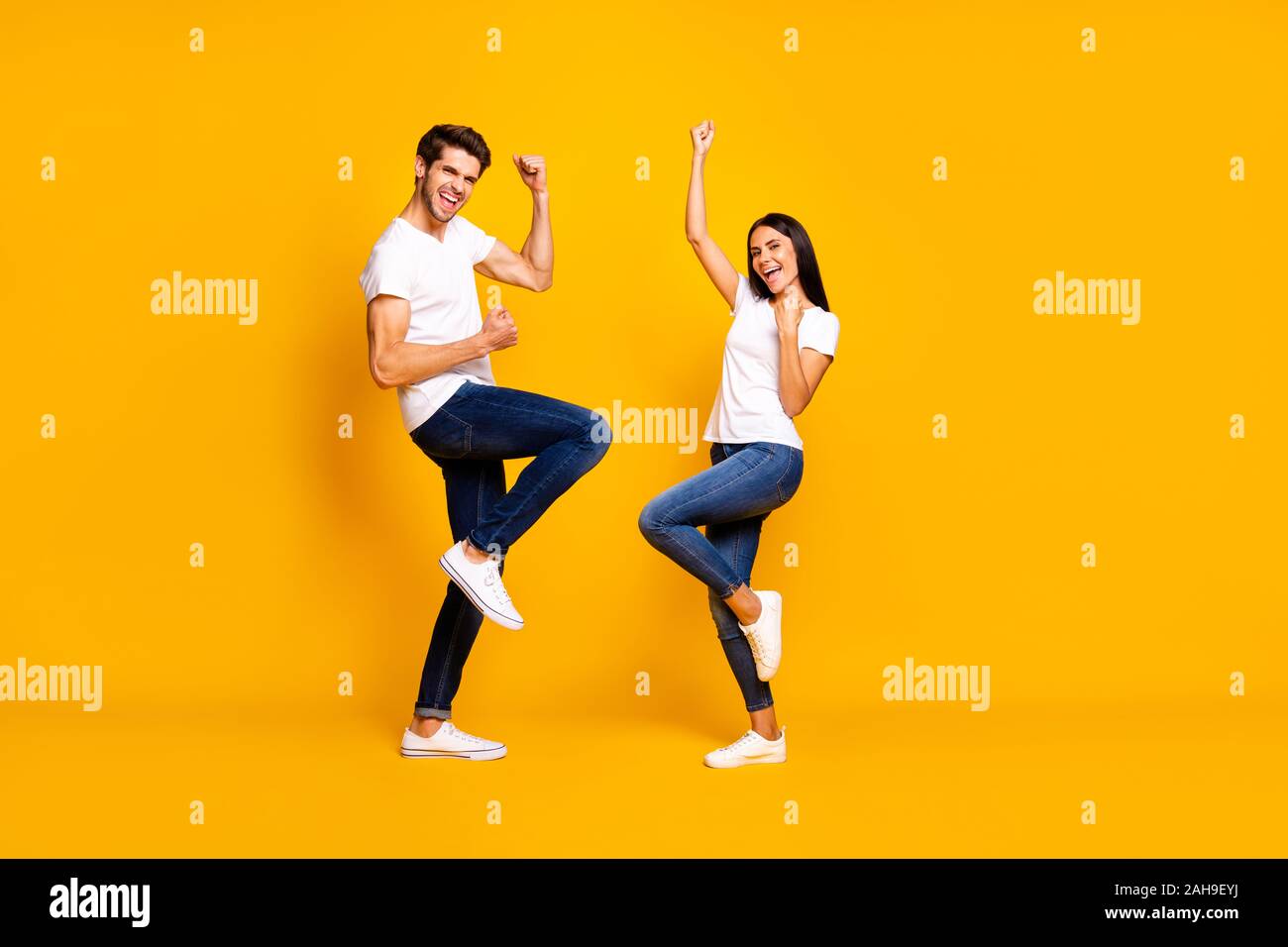Full body photo of pair lady and guy fans supporting favorite football ...