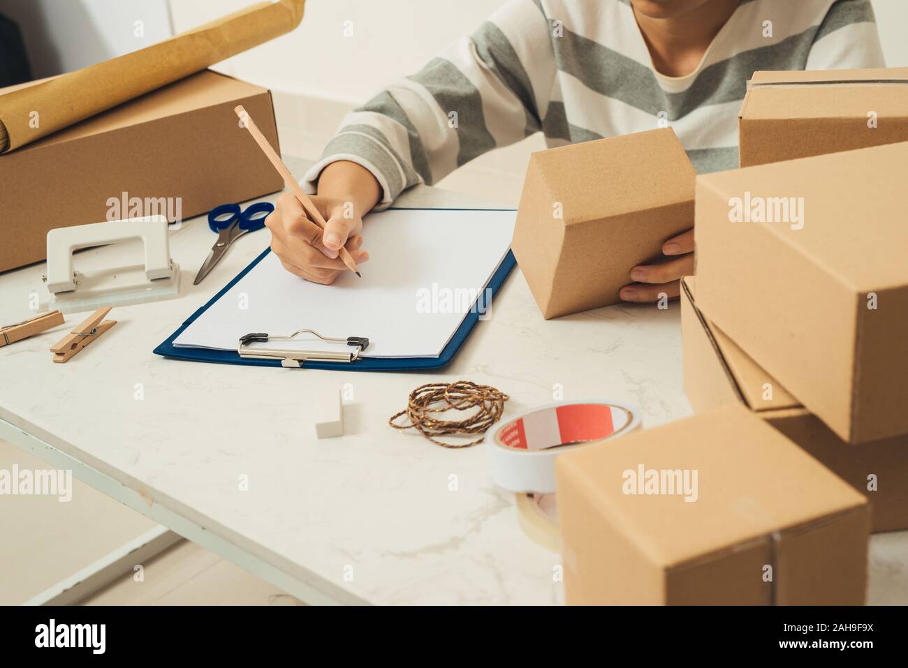 Worker are writing on the clipboard, Checking items list Stock Photo ...