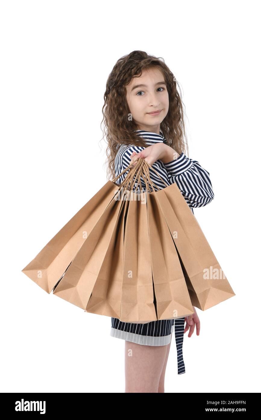 Child with a packet isolated on white background. Kid happy shopping in ...