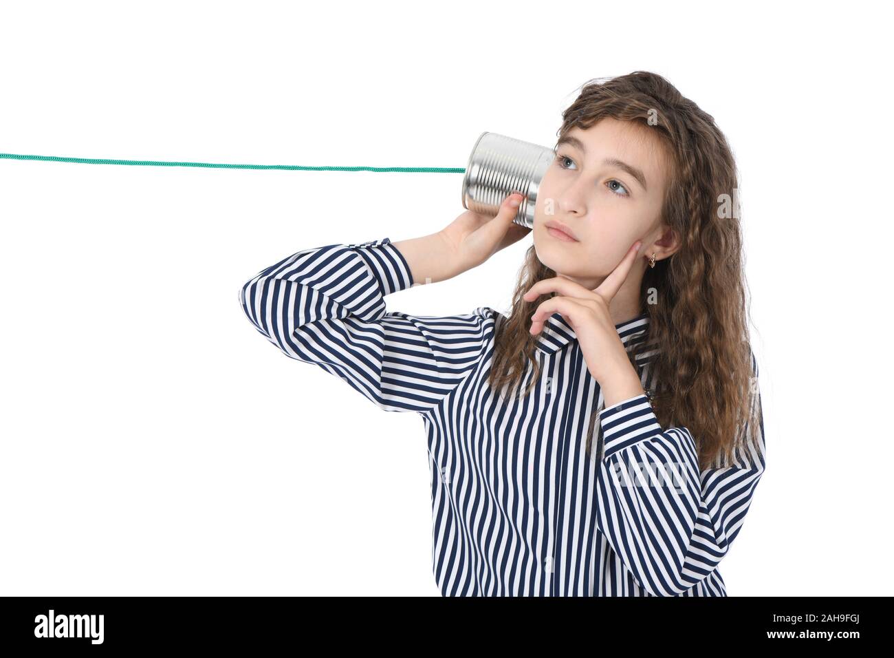 Young girl call by tin can phone isolated on white. High resolution ...