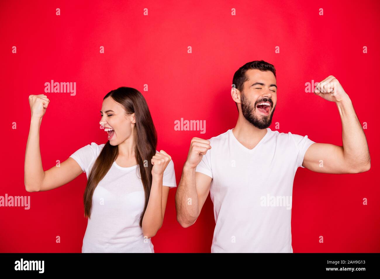 Photo of two trendy rejoicing overjoyed people celebrating their ...