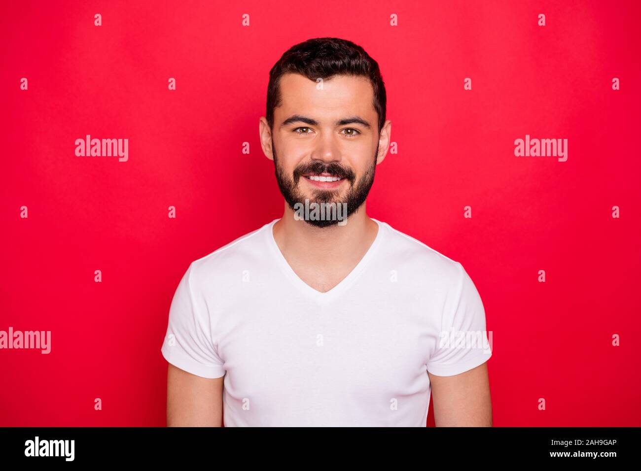 Close up photo of man staring into camera candidly while isolated over ...
