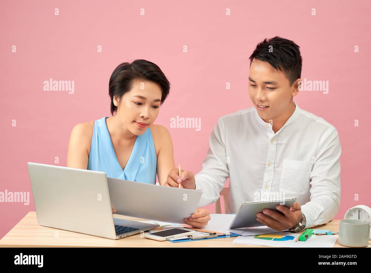 Smiling creative businesswomen using computer hi-res stock photography ...