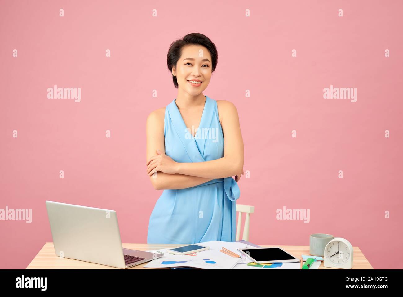 Confident Asian female freelancer at her workspace desk Stock Photo - Alamy