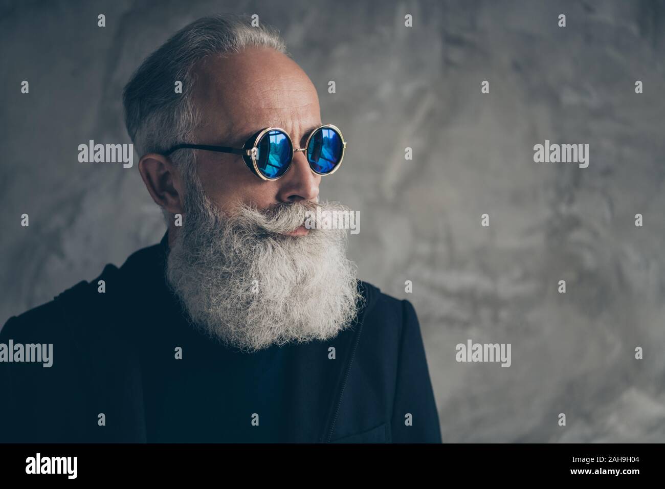 Close up phoro of concentrated harsh masculine old person in eyewear ...