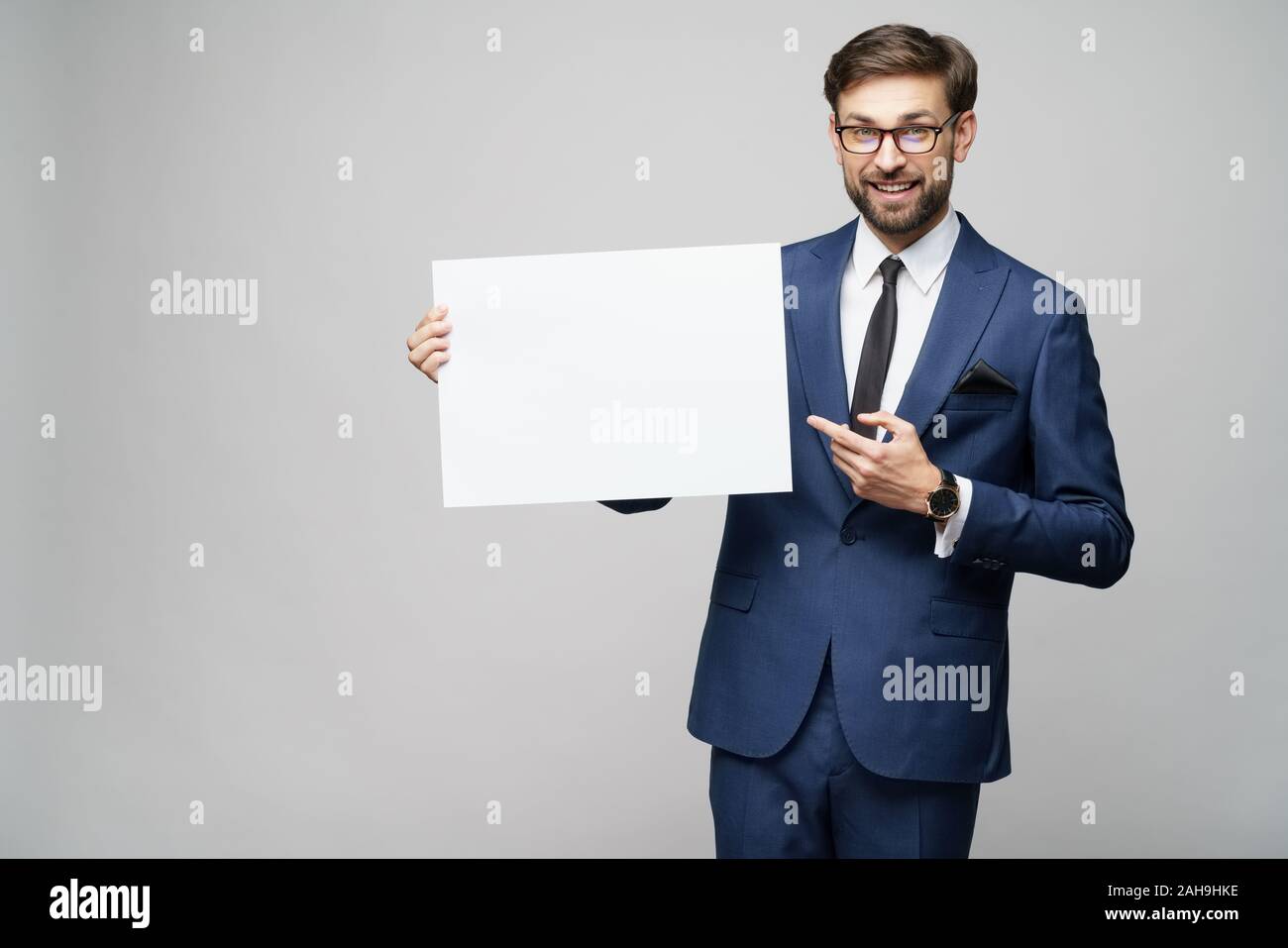 Young men holding signs hi-res stock photography and images - Alamy