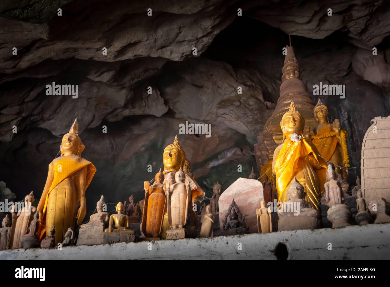 Buddha statues in cave at Pak Ou, Laos Stock Photo - Alamy