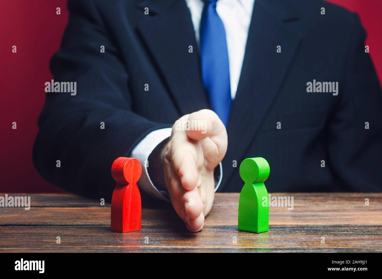 Man divides warring parties conflict with a hand. Mediator services ...