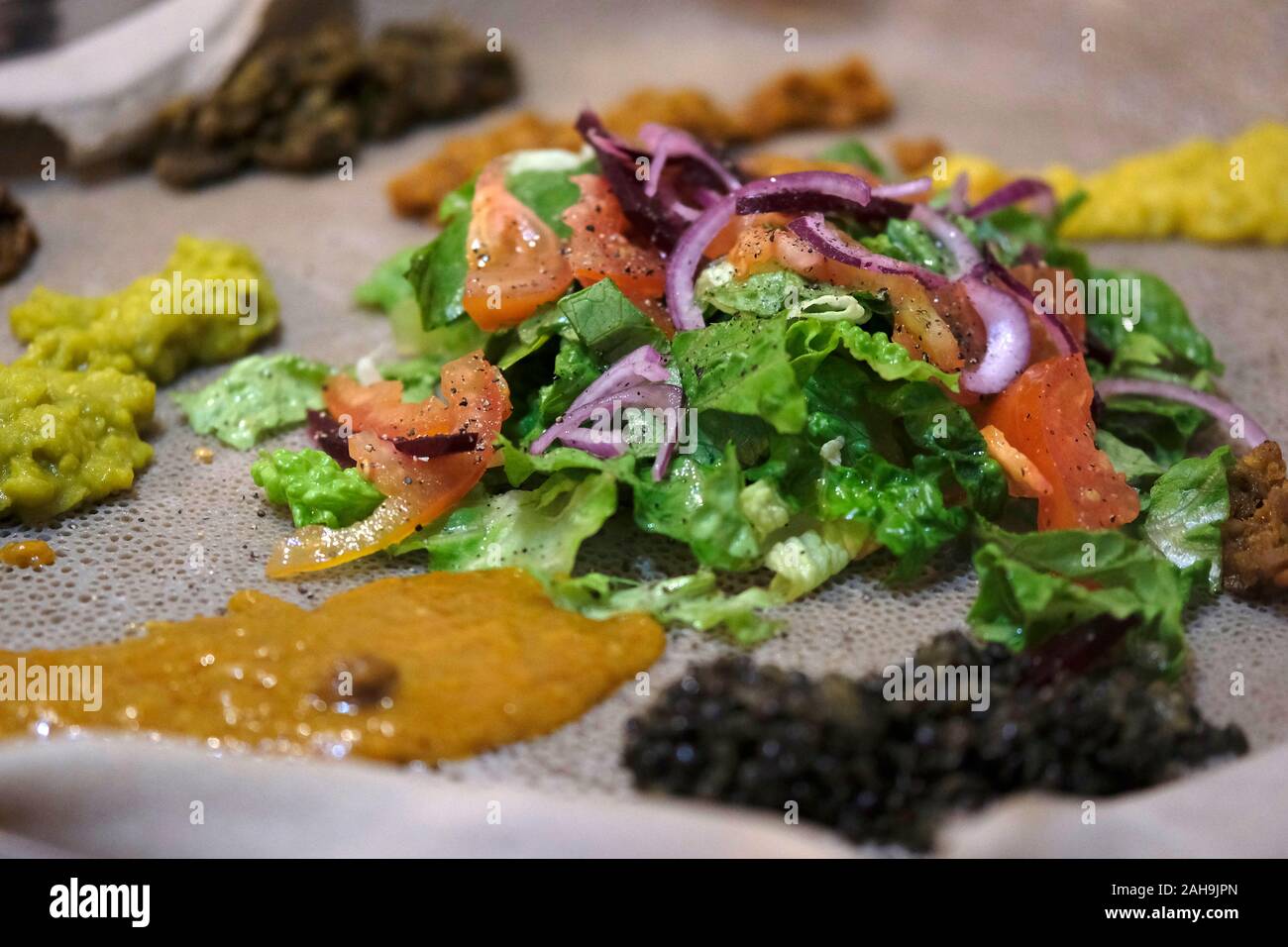 A roll of Injera roll which is a sourdough-risen flatbread with a ...