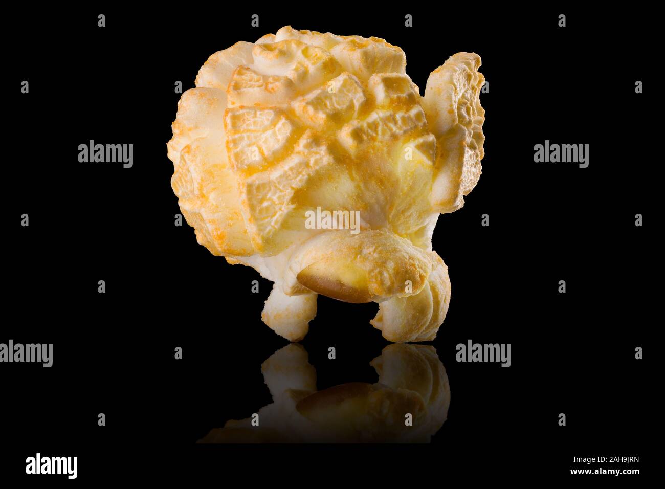 Single popped popcorn on a black backgroundwith clipping path Stock ...