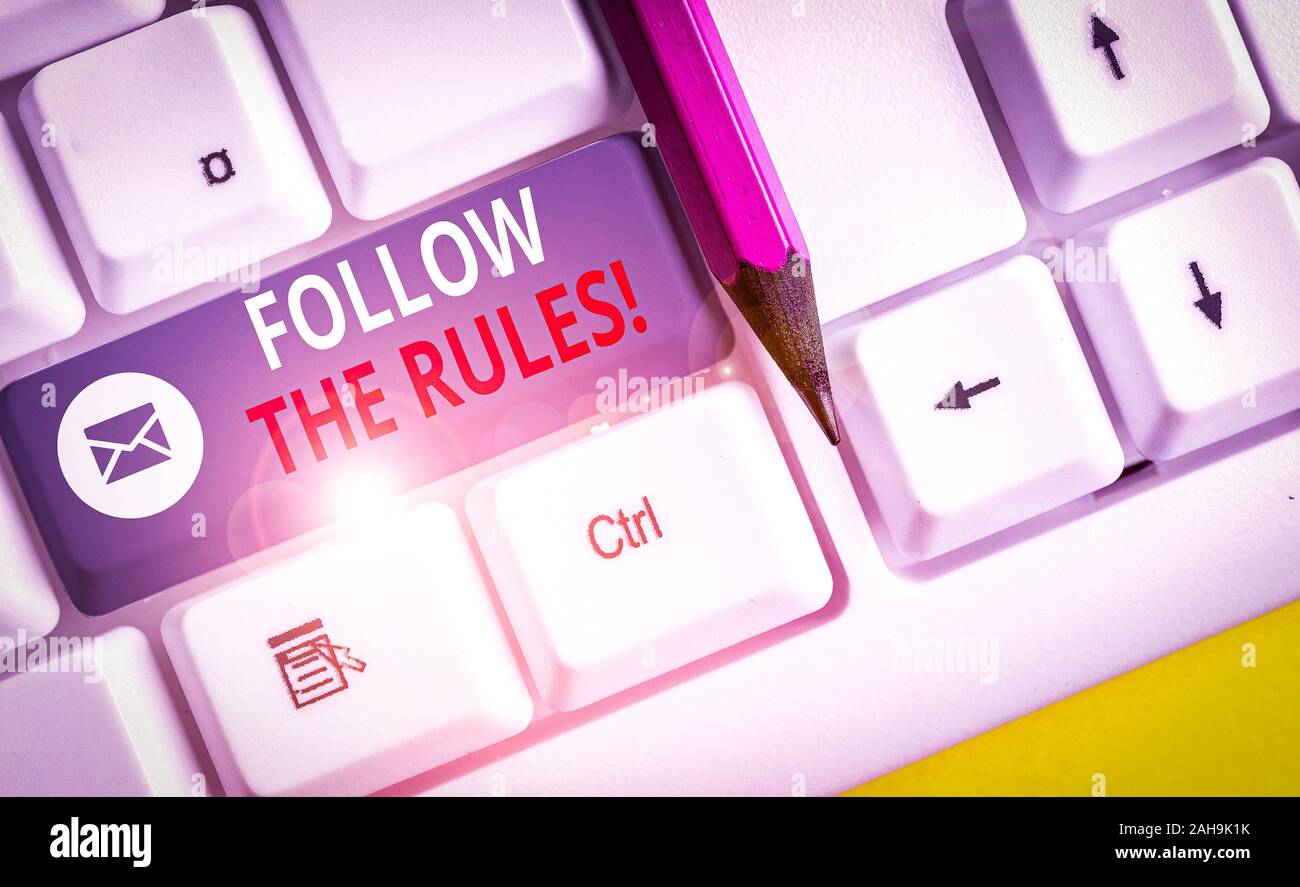 Writing note showing Follow The Rules. Business concept for go with ...