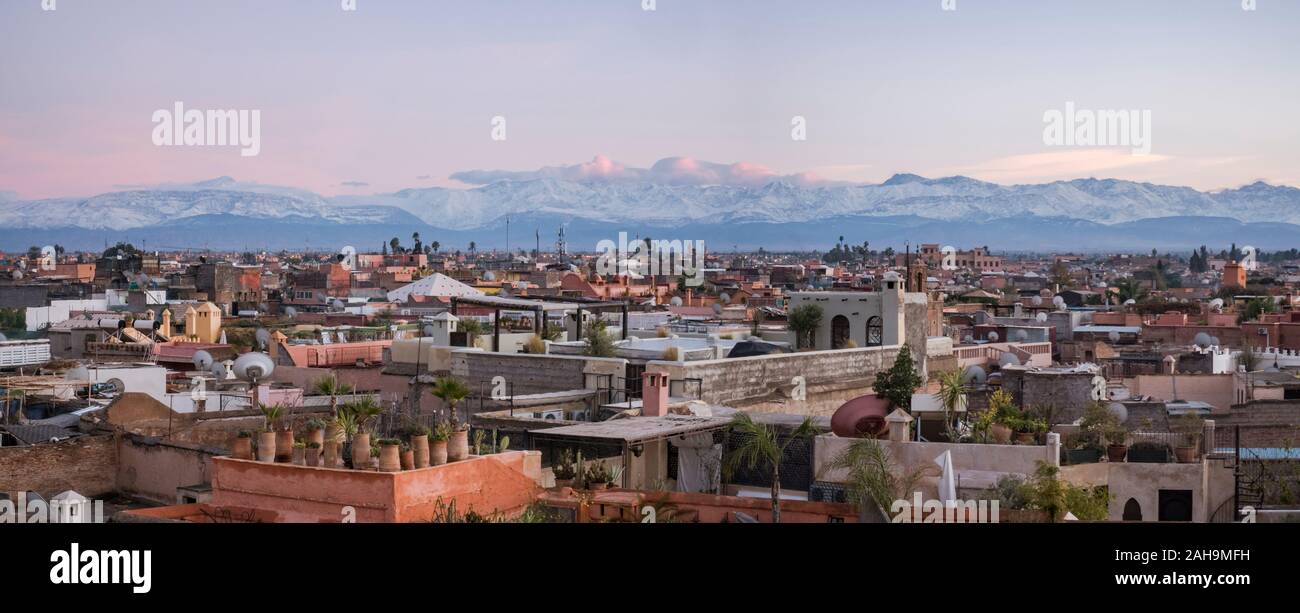 Marrakech city skyline in Medina area, with Atlas mountains behind, at ...