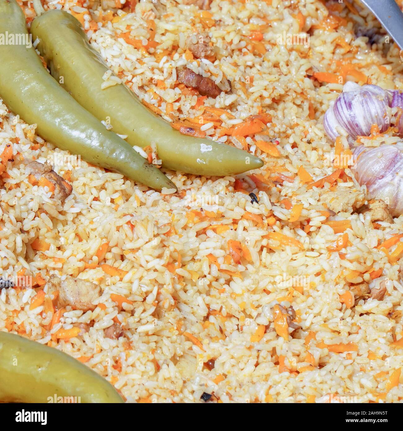 Traditional delicious pilaf with vegetables in a cauldron Stock Photo ...